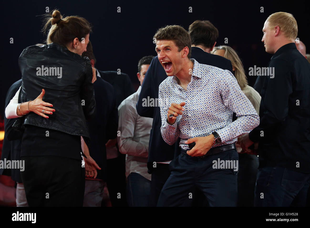 Munich, Germany. 14th May, 2016. Thomas Muller laughs on stage with his ...