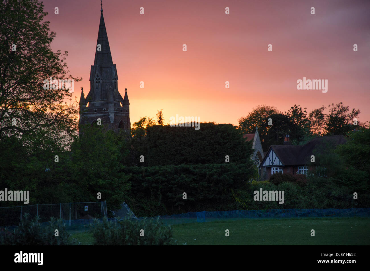 St Michael's Church Spire at Tilehurst, Reading against an orange ...