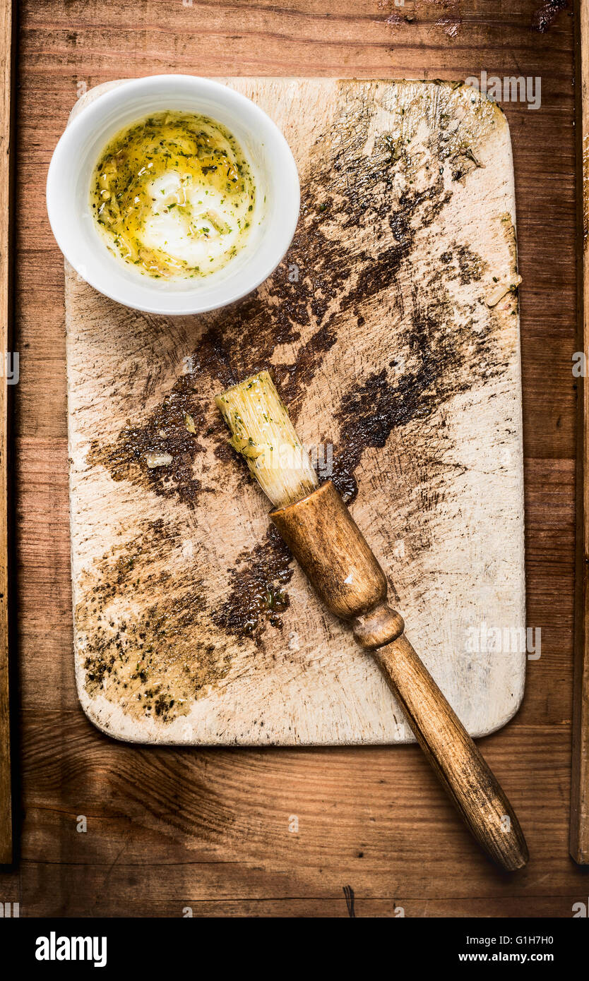 Oil marinate and brush on rustic gutting board, top view Stock Photo ...