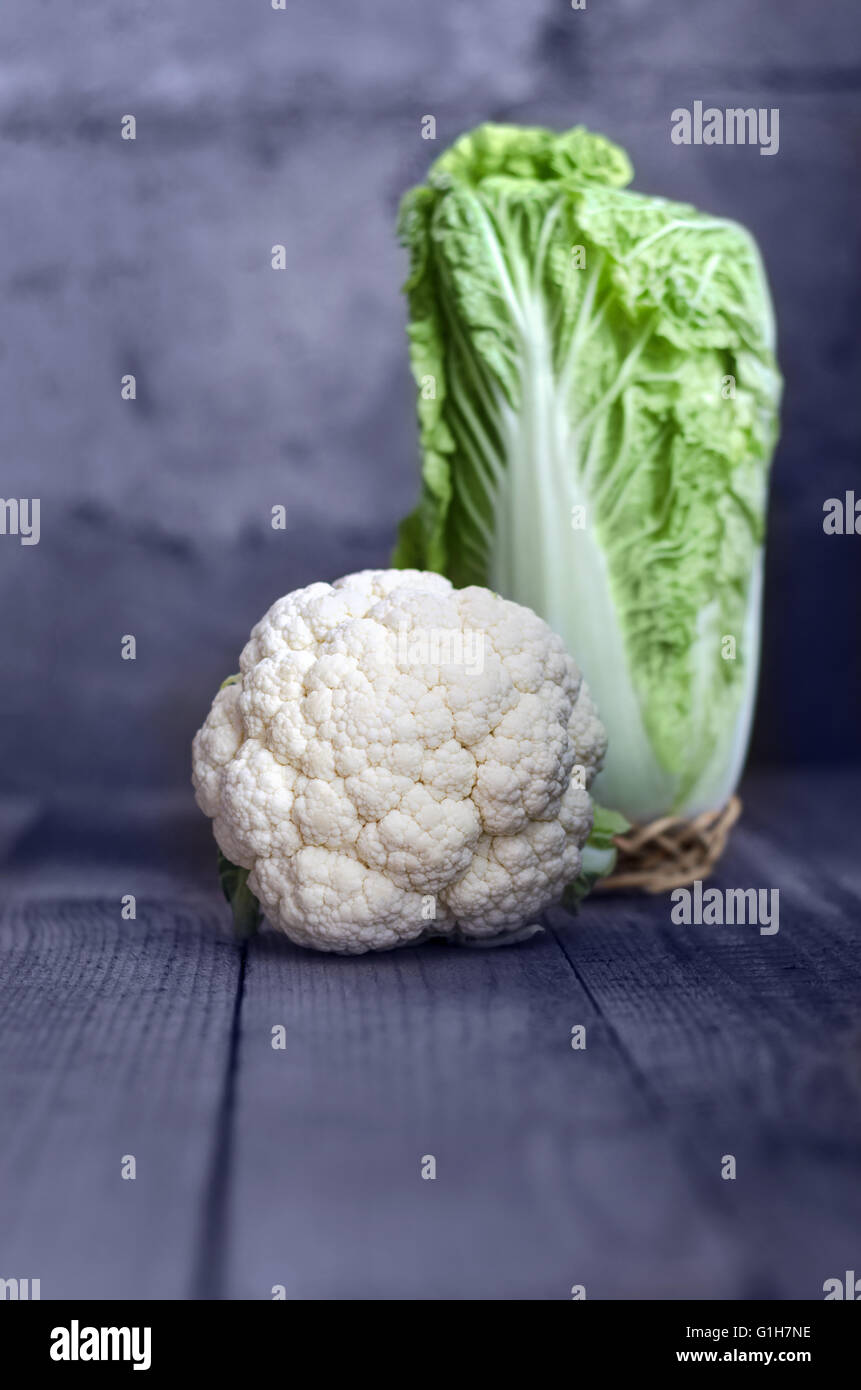 Different a whole cabbage on the old Board rustic Stock Photo - Alamy