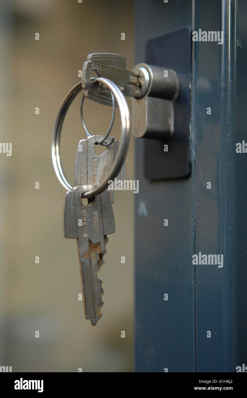 Set of keys in door Stock Photo - Alamy