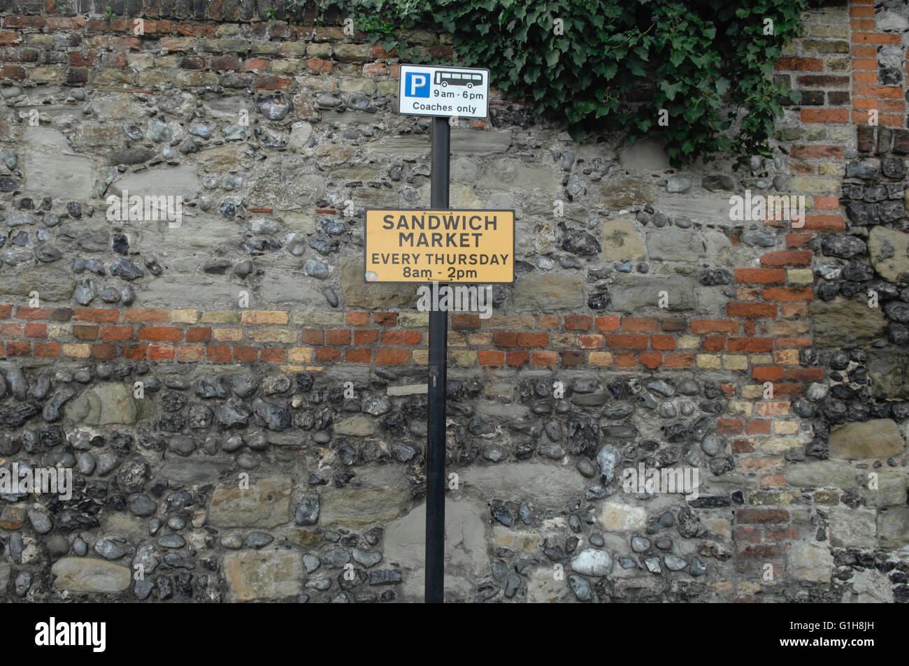Bus stop sign with Sandwich market sign underneath it in Sandwich ...