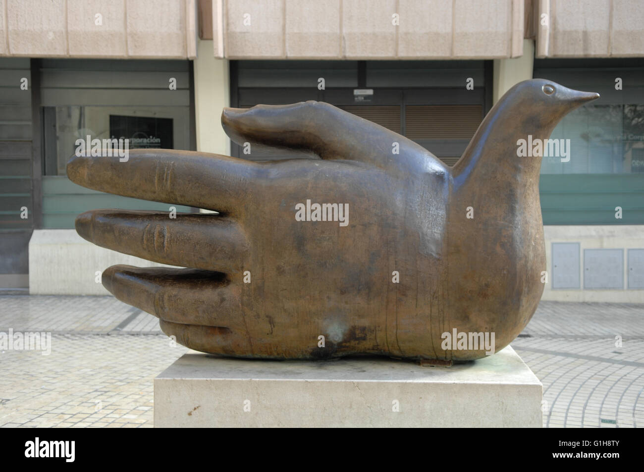 Sculpture of a dove hand in the center of Malaga Spain Stock Photo - Alamy