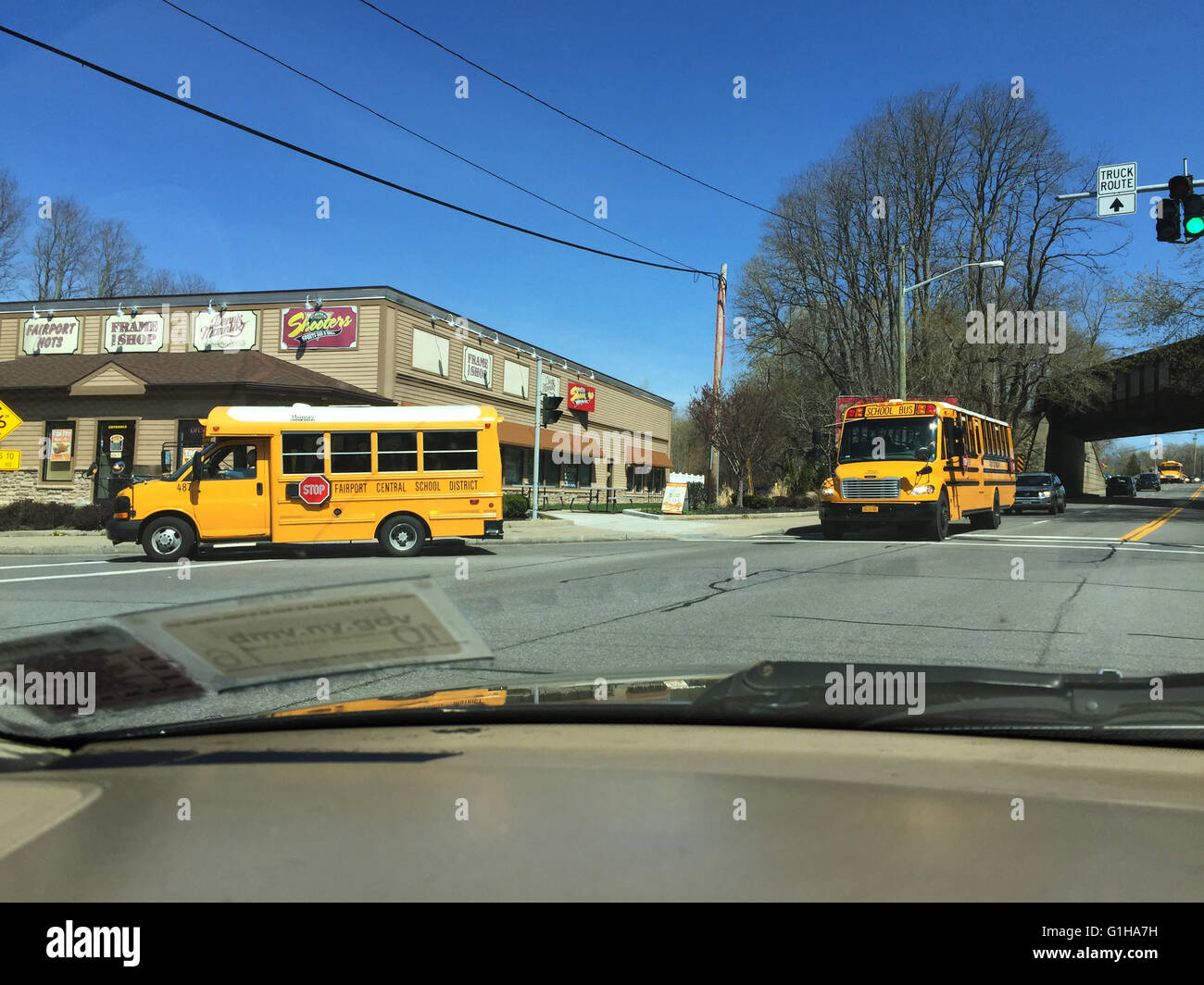 School buses turning Stock Photo - Alamy