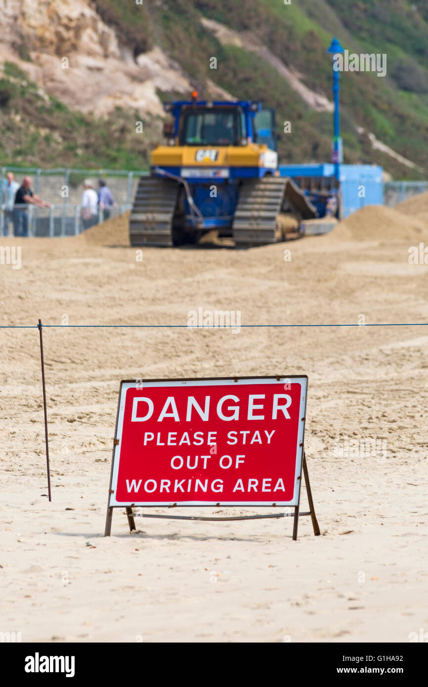 Danger please stay out of working area sign on Bournemouth beach ...