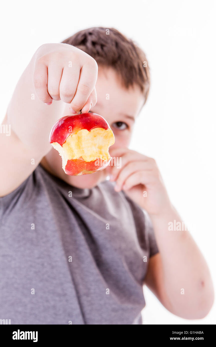 little boy with food isolated on white background - apple or a muffin ...
