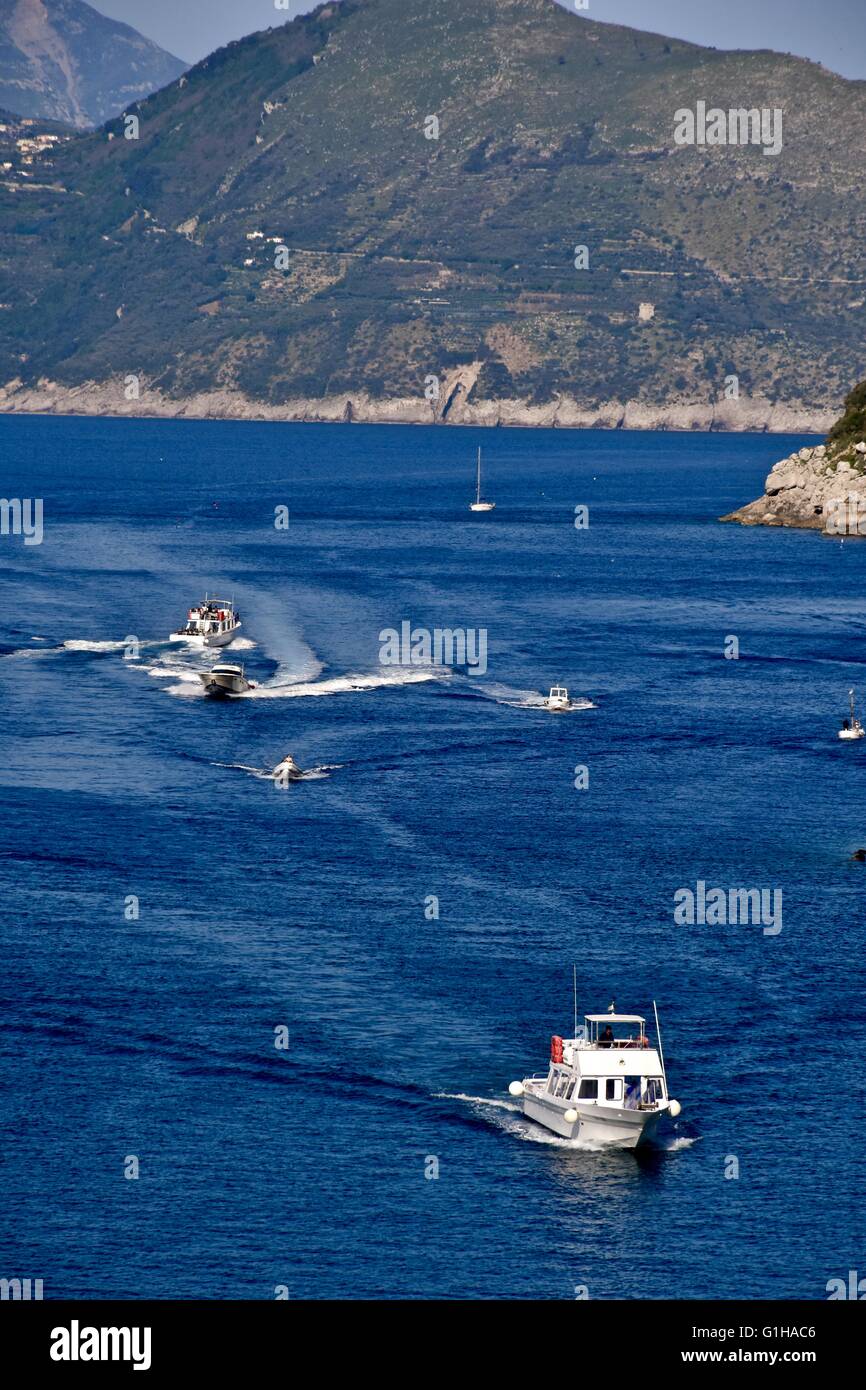 Boats driving through the ocean right off the Capri island shore Stock ...