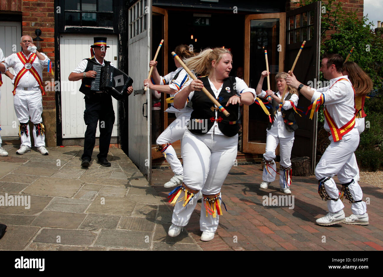 Morris dancers and musicians perform outside the Bell pub in Ticehurst ...