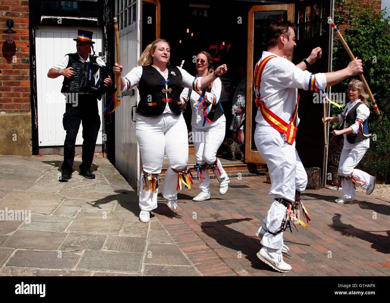 Morris dancers and musicians perform outside the Bell pub in Ticehurst ...
