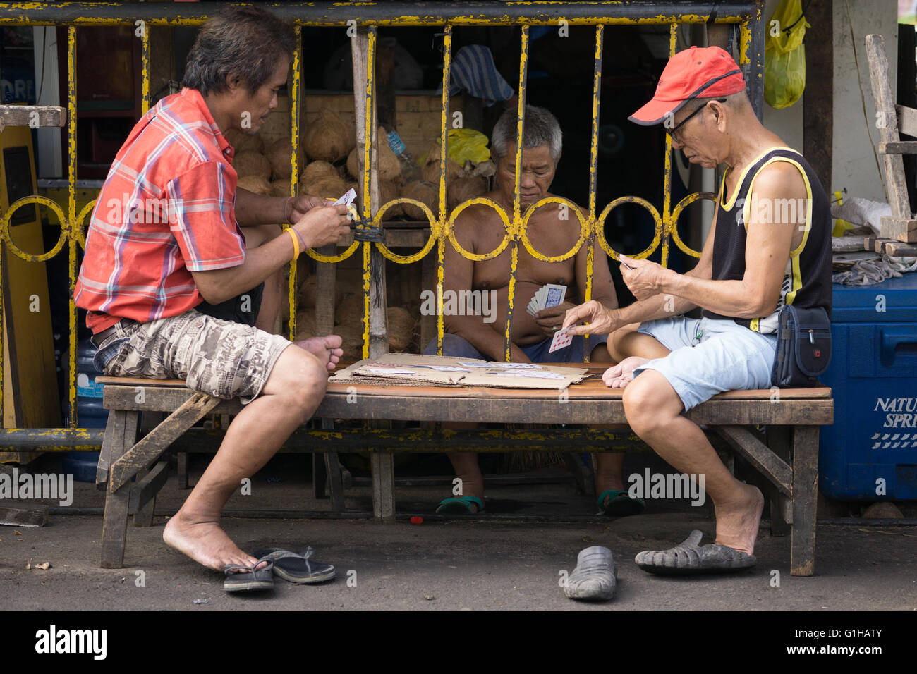 Filipino Men playing cards within the Carbon Market located in Downtown ...