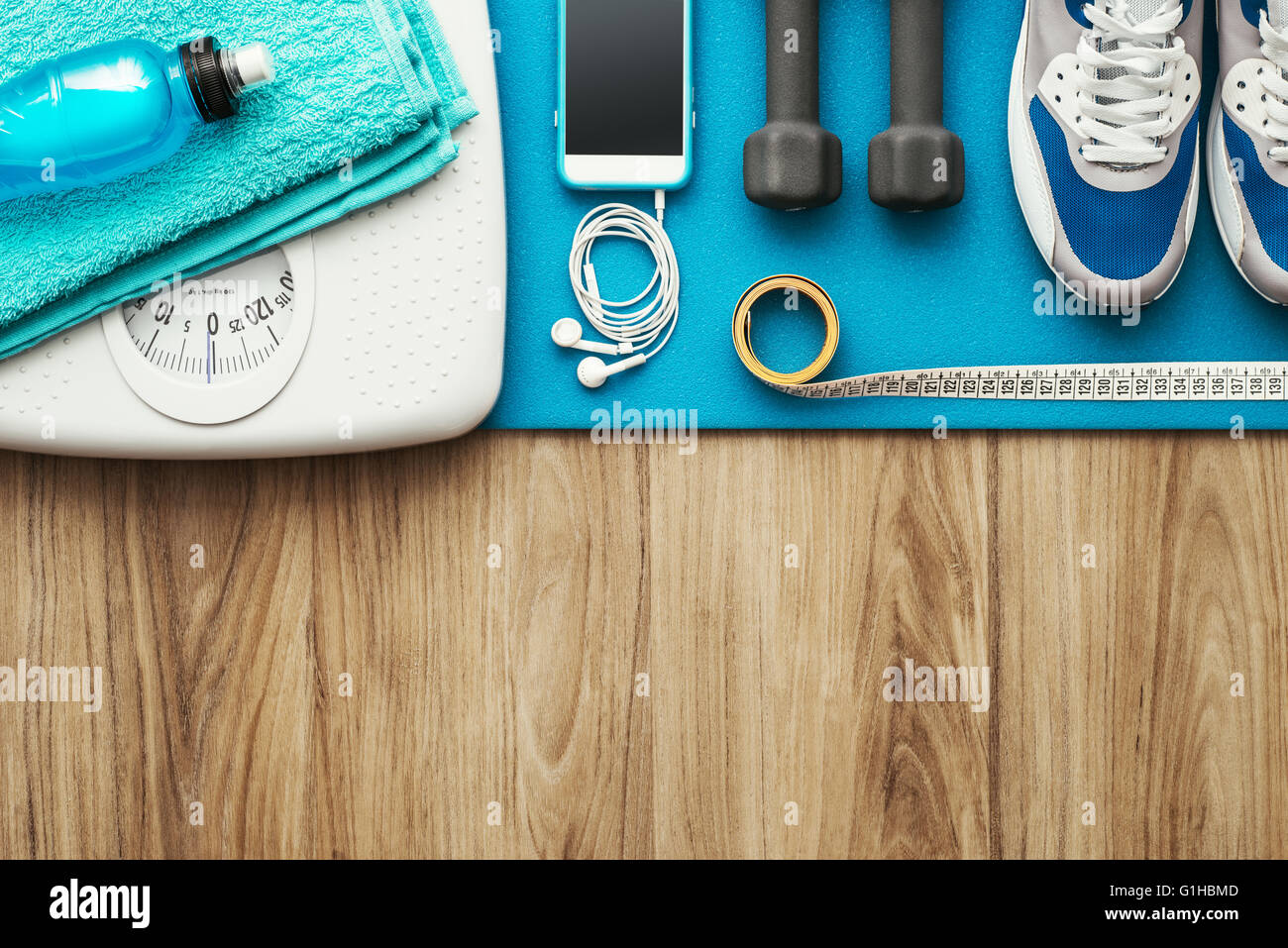 Training and sports equipment on a mat and weight scale, healthy ...