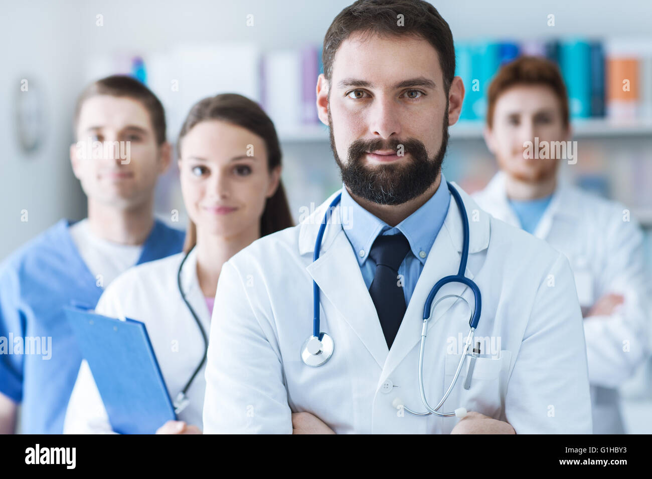 Medical team posing at the hospital they are standing and looking at ...