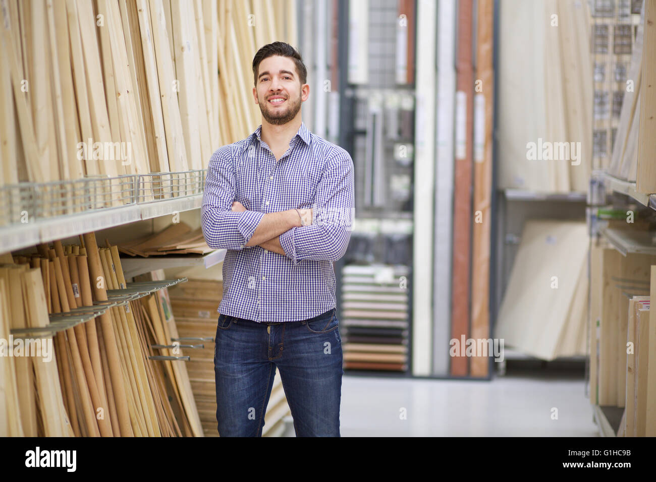 young man working in hardware store Stock Photo - Alamy