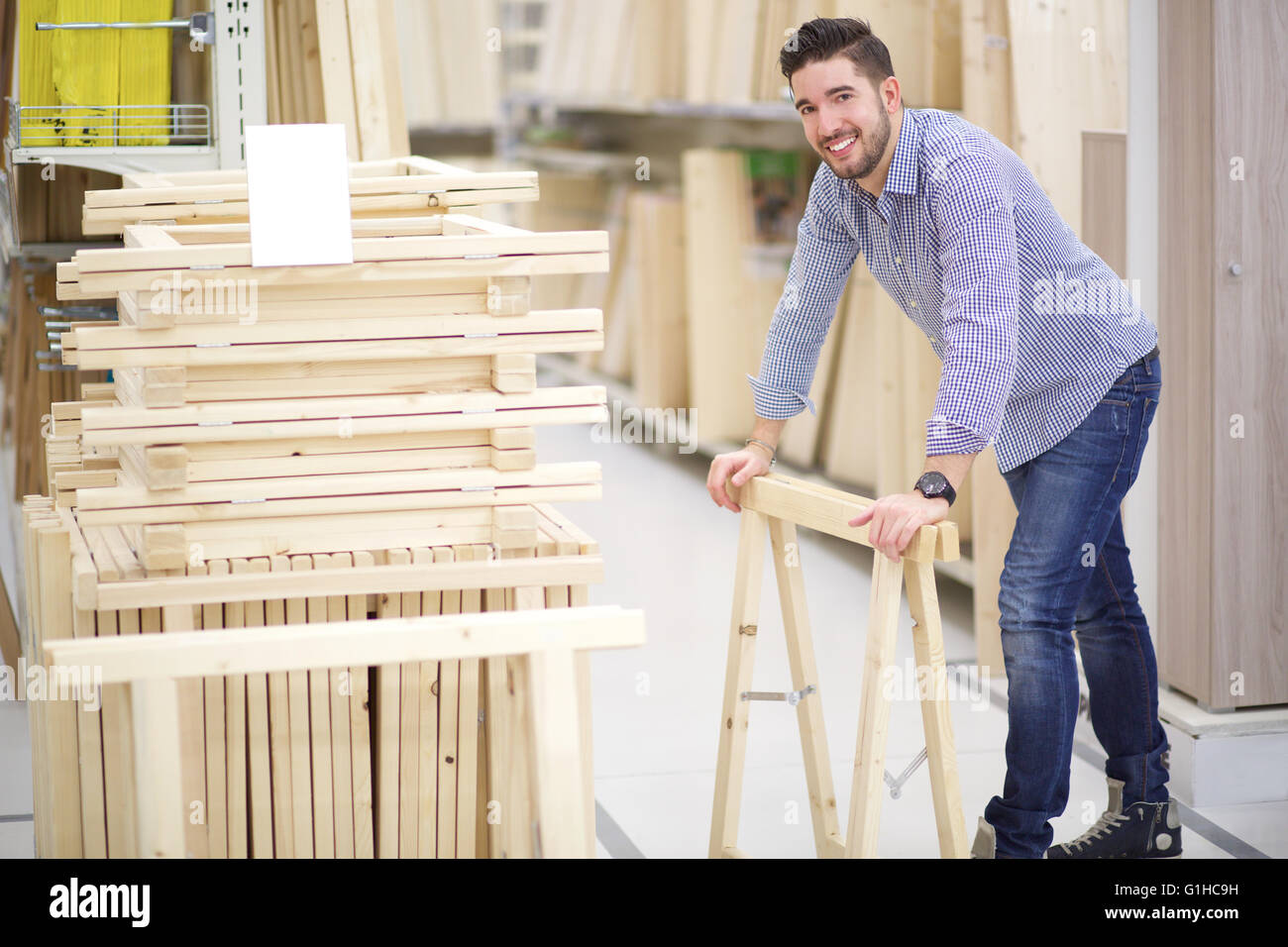 young man working in hardware store Stock Photo - Alamy