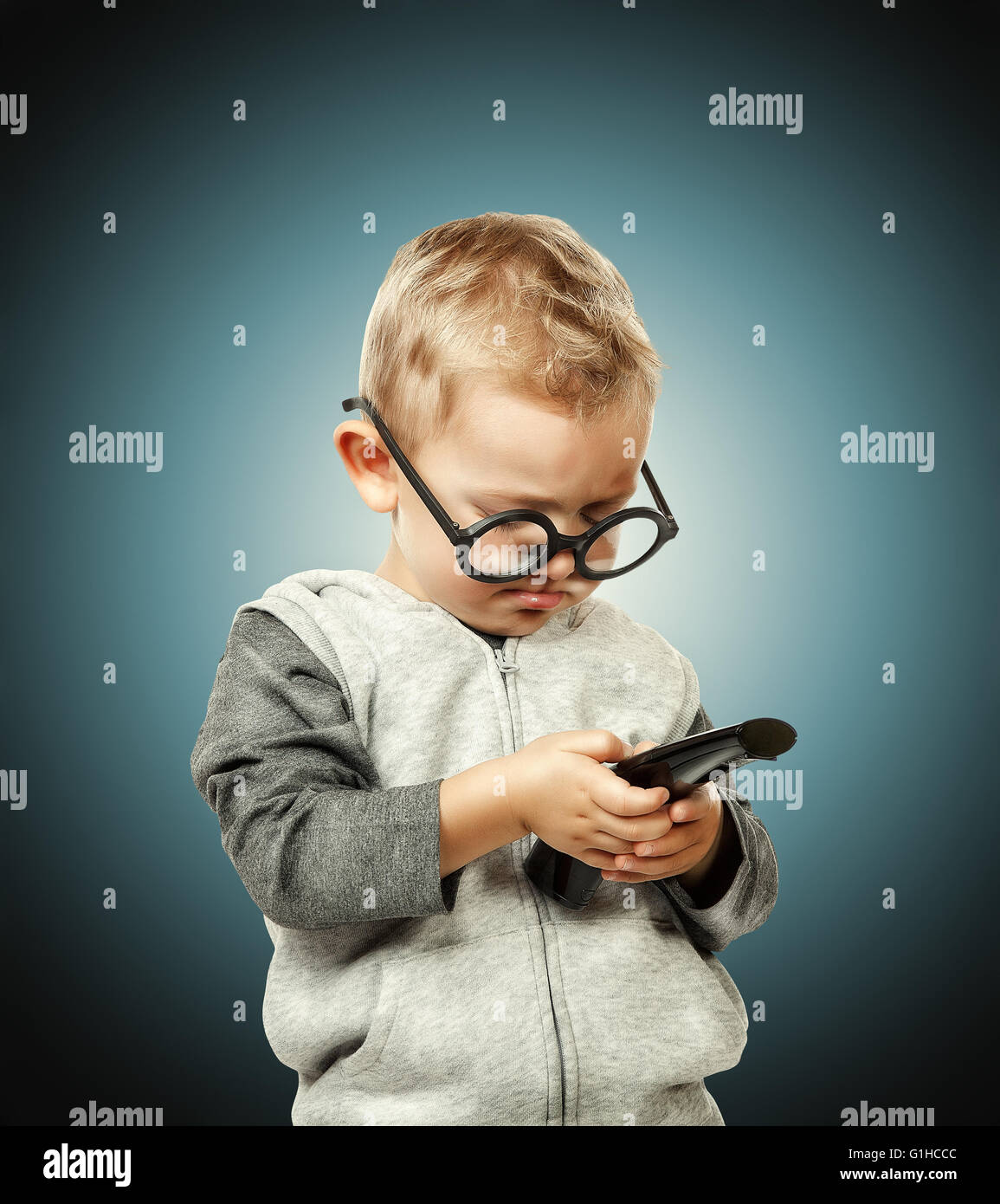 little child with remote control Stock Photo - Alamy