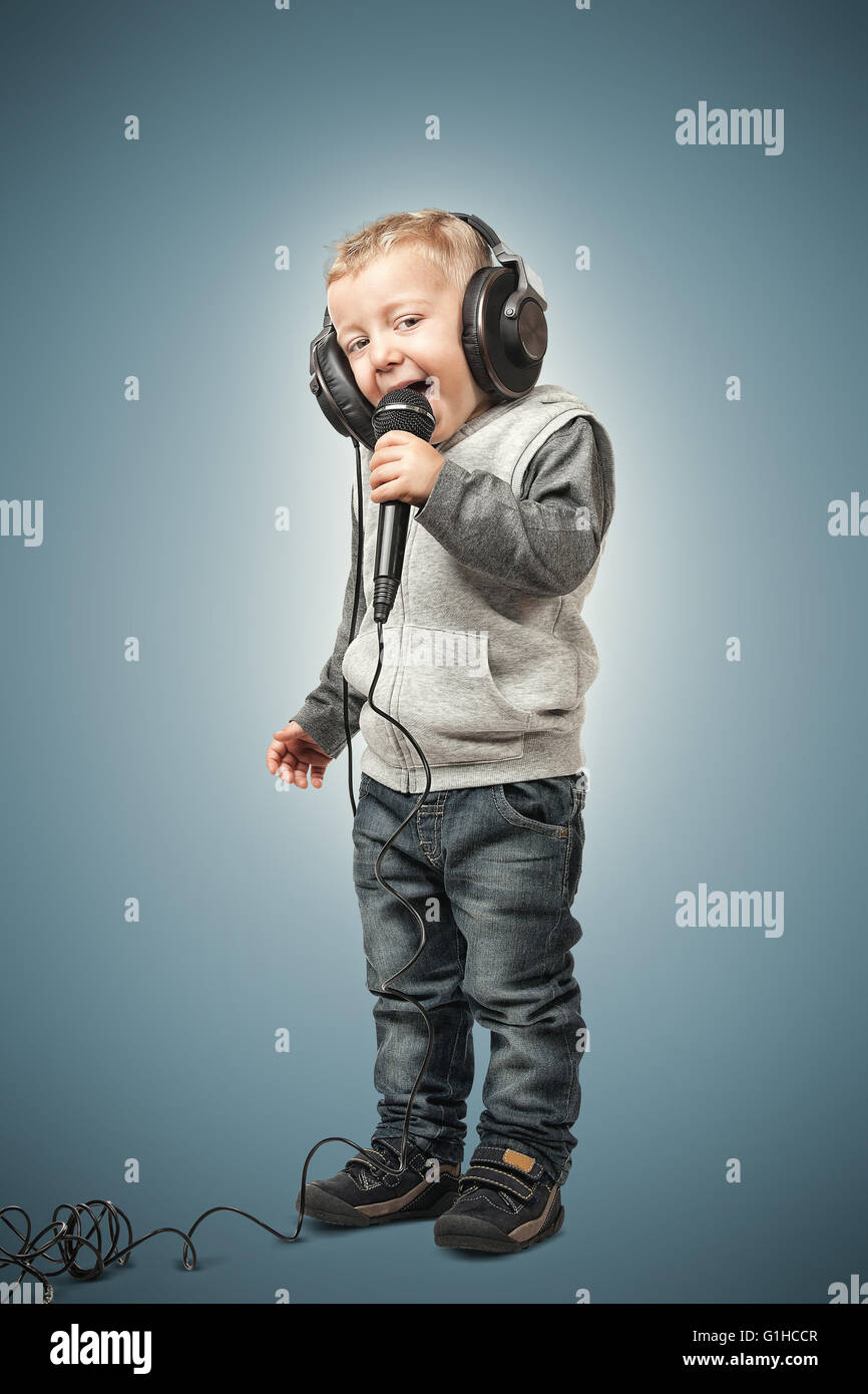 little child with microphone and headphone Stock Photo - Alamy