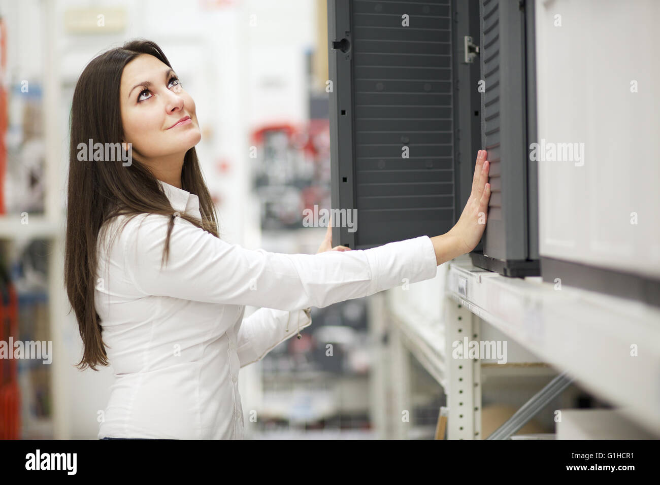 young woman buy in hardware store Stock Photo - Alamy