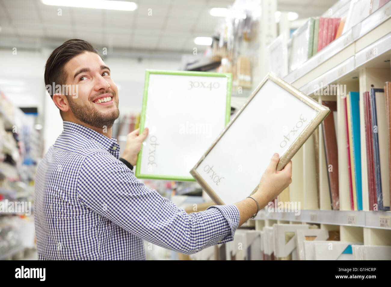 young man working in hardware store Stock Photo - Alamy