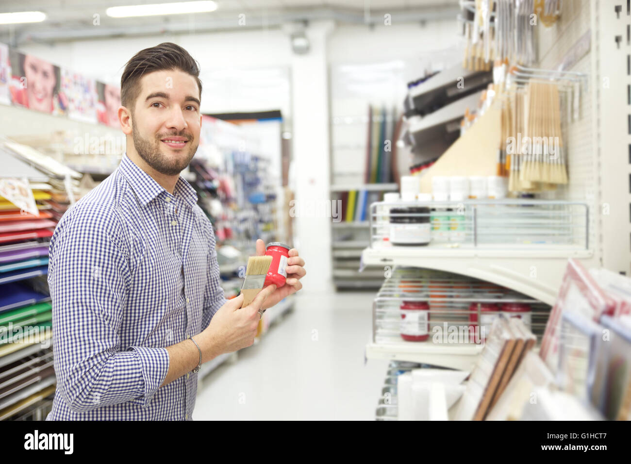 young man working in hardware store Stock Photo - Alamy