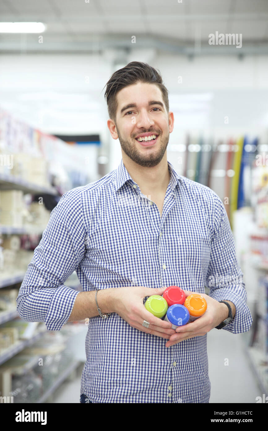 young man working in hardware store Stock Photo - Alamy