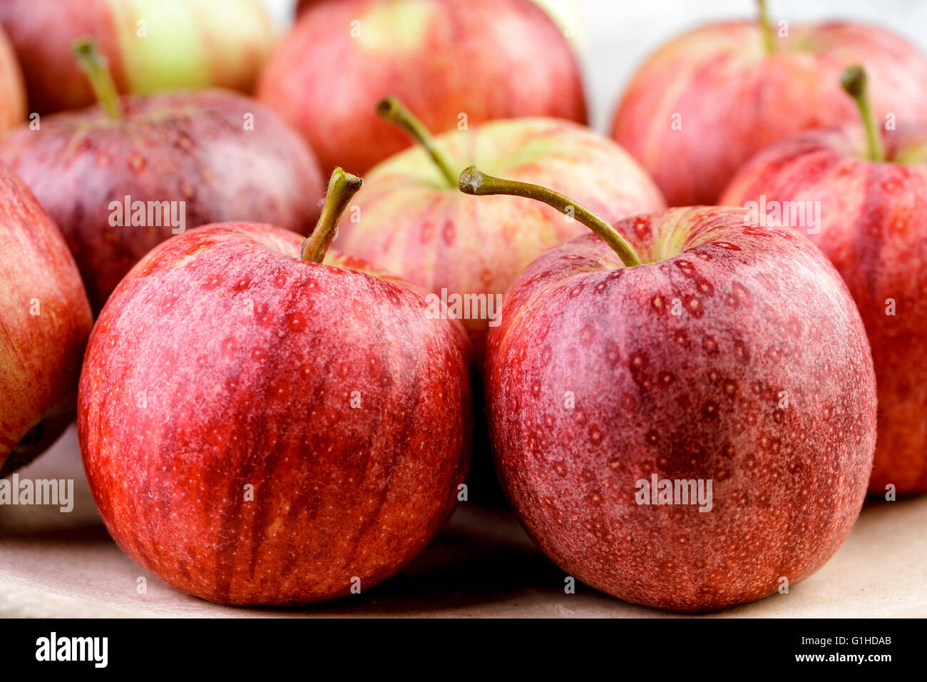 Fresh and Ripe Red Apples on Stoneware Plate Stock Photo - Alamy