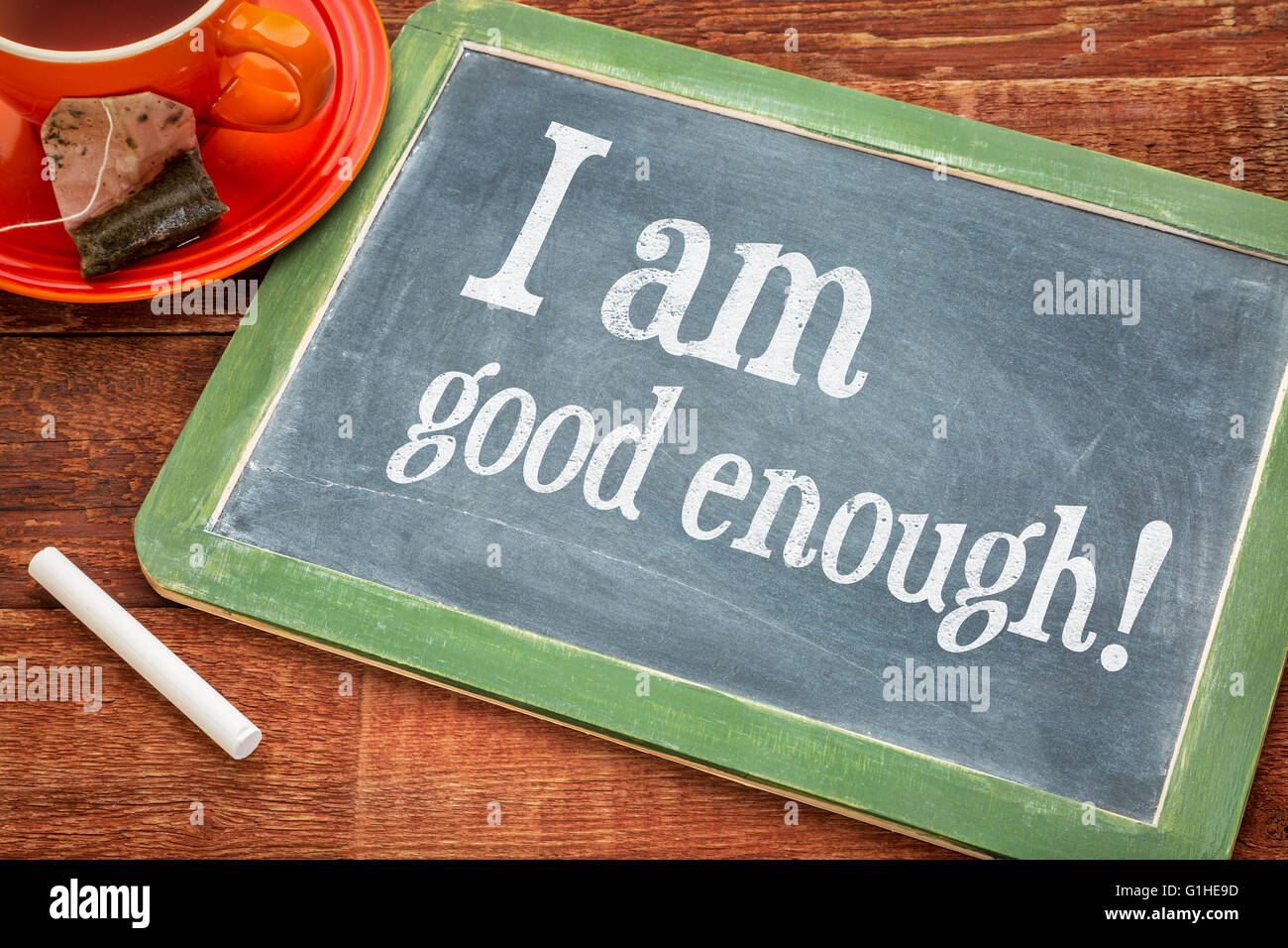 I am good enough - positive affirmation on a slate blackboard with ...