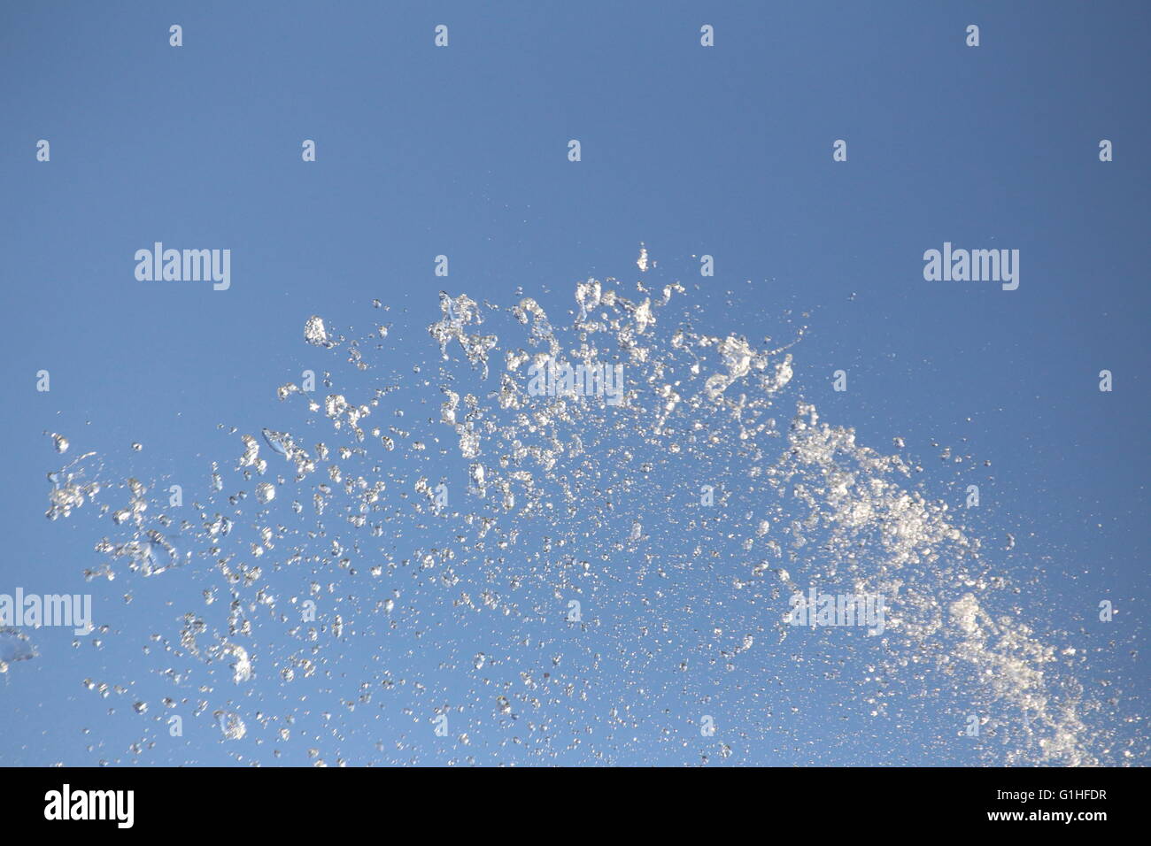 Water drops spraying from a fountain Stock Photo - Alamy