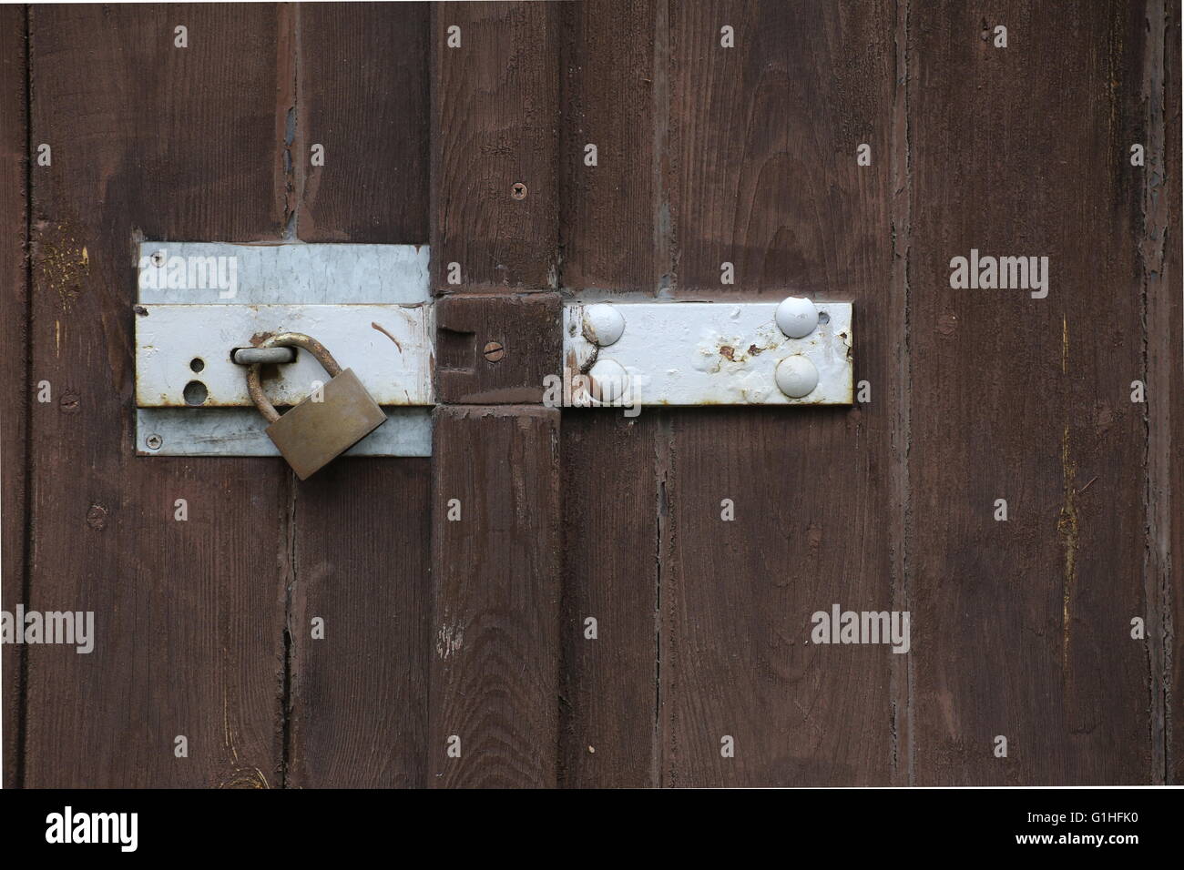 Padlock hanging at a gate Stock Photo - Alamy