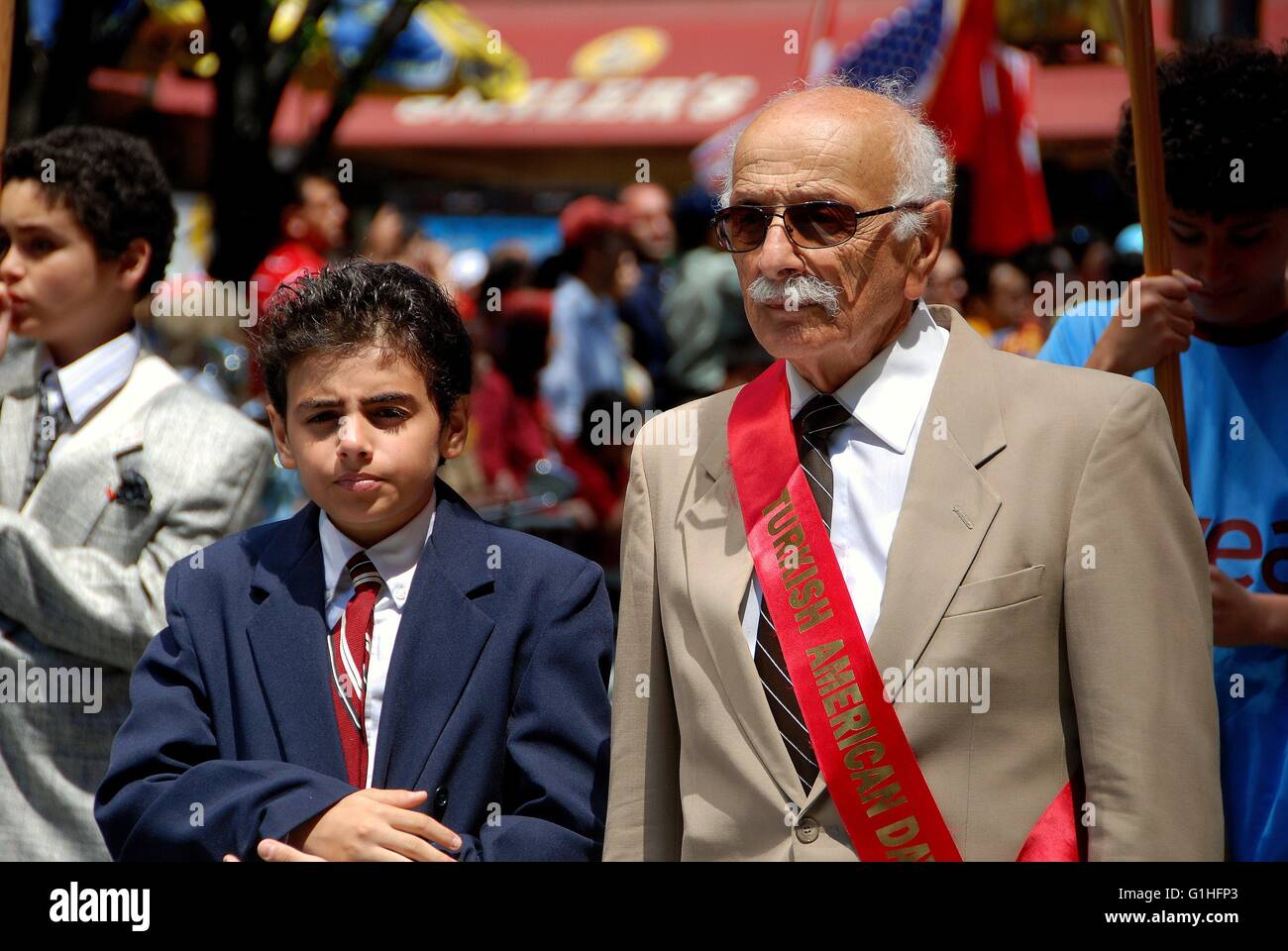 New York City: Elderly gentleman marching with his grandson in the ...