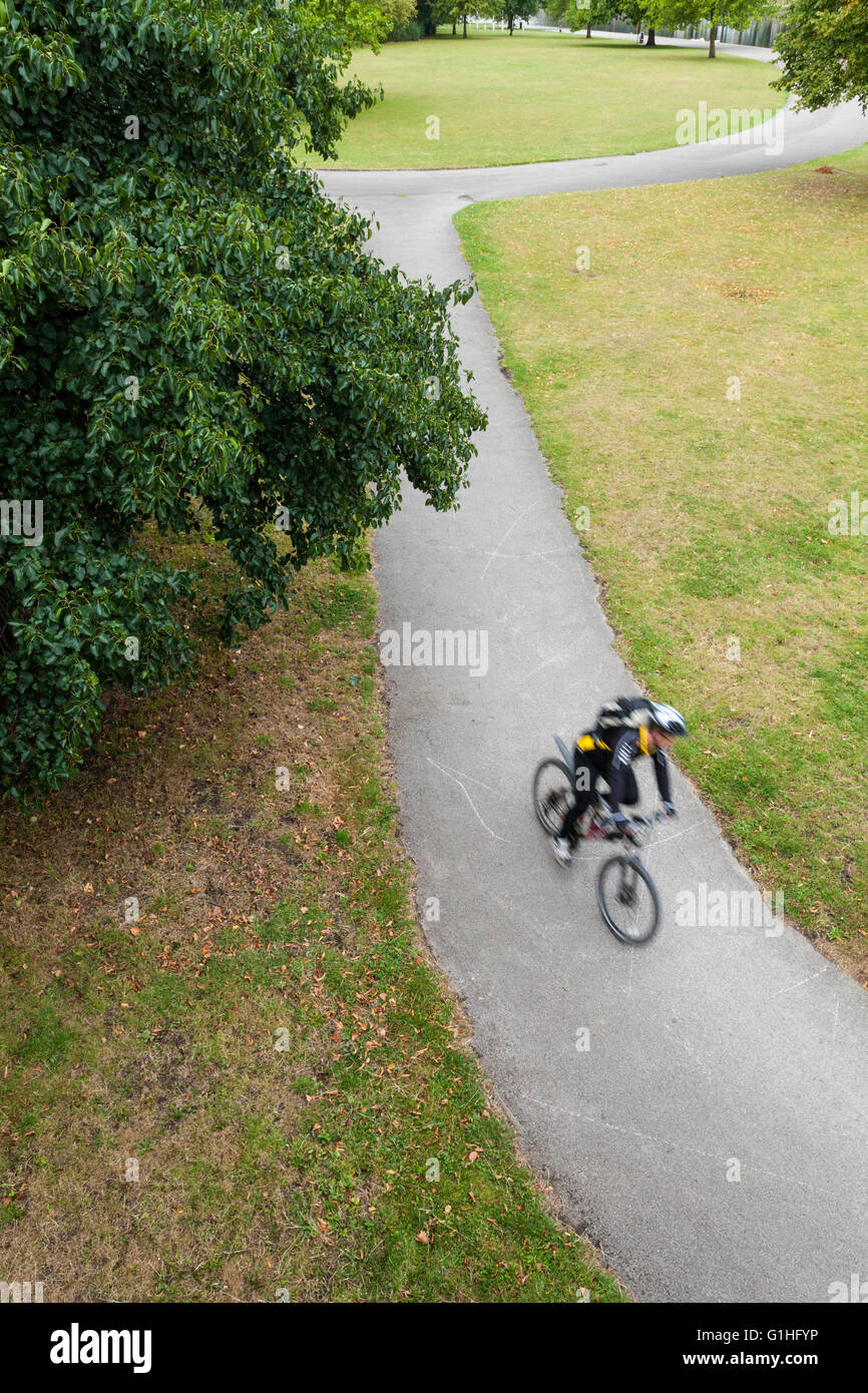 Cyclist, seen from above, cycling along a cycle path, Nottinghamshire ...