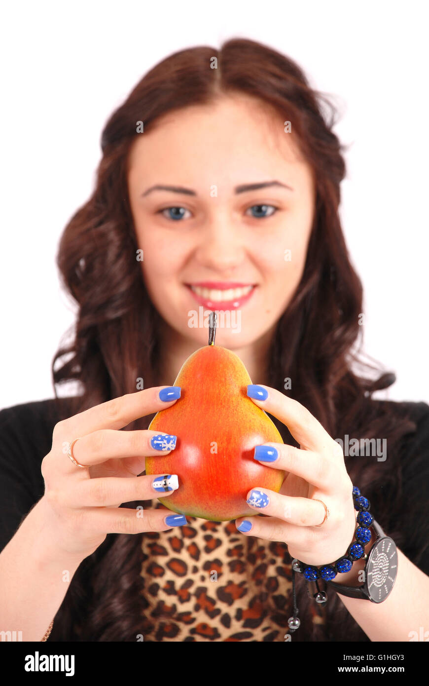 Teen girl offering a pear to someone, focus on pear. Isolated on white ...