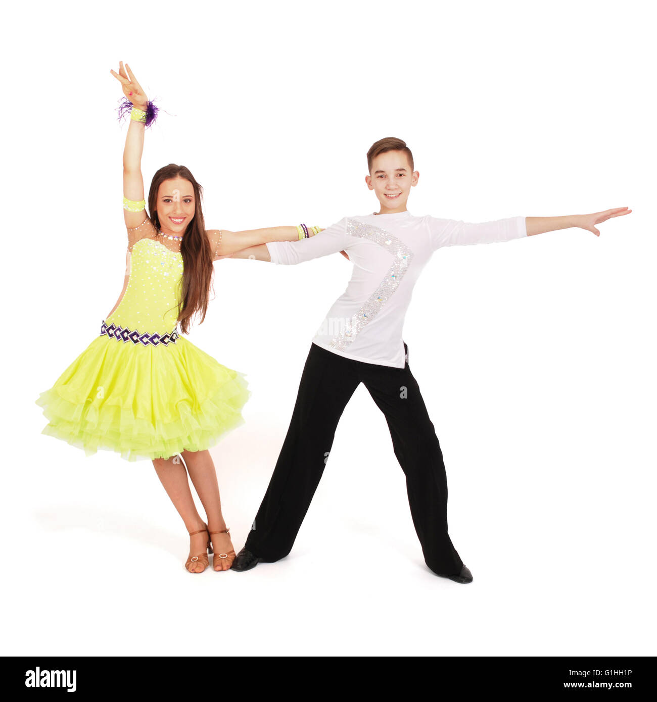 Boy and girl dancing ballroom dance on white background Stock Photo - Alamy