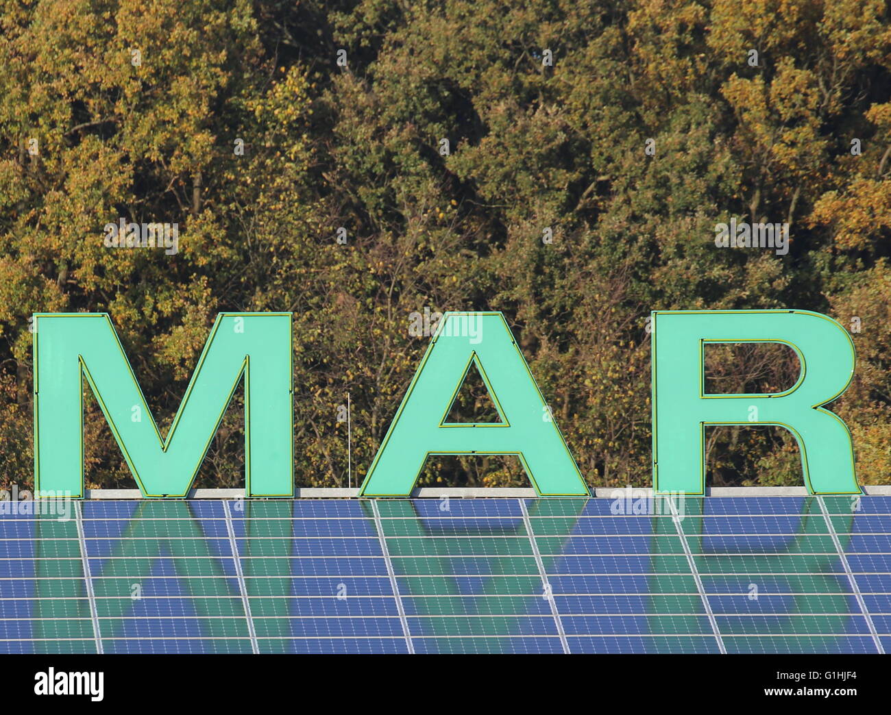 Letters MAR (a name fragment) on a roof reflected by solar panels Stock ...