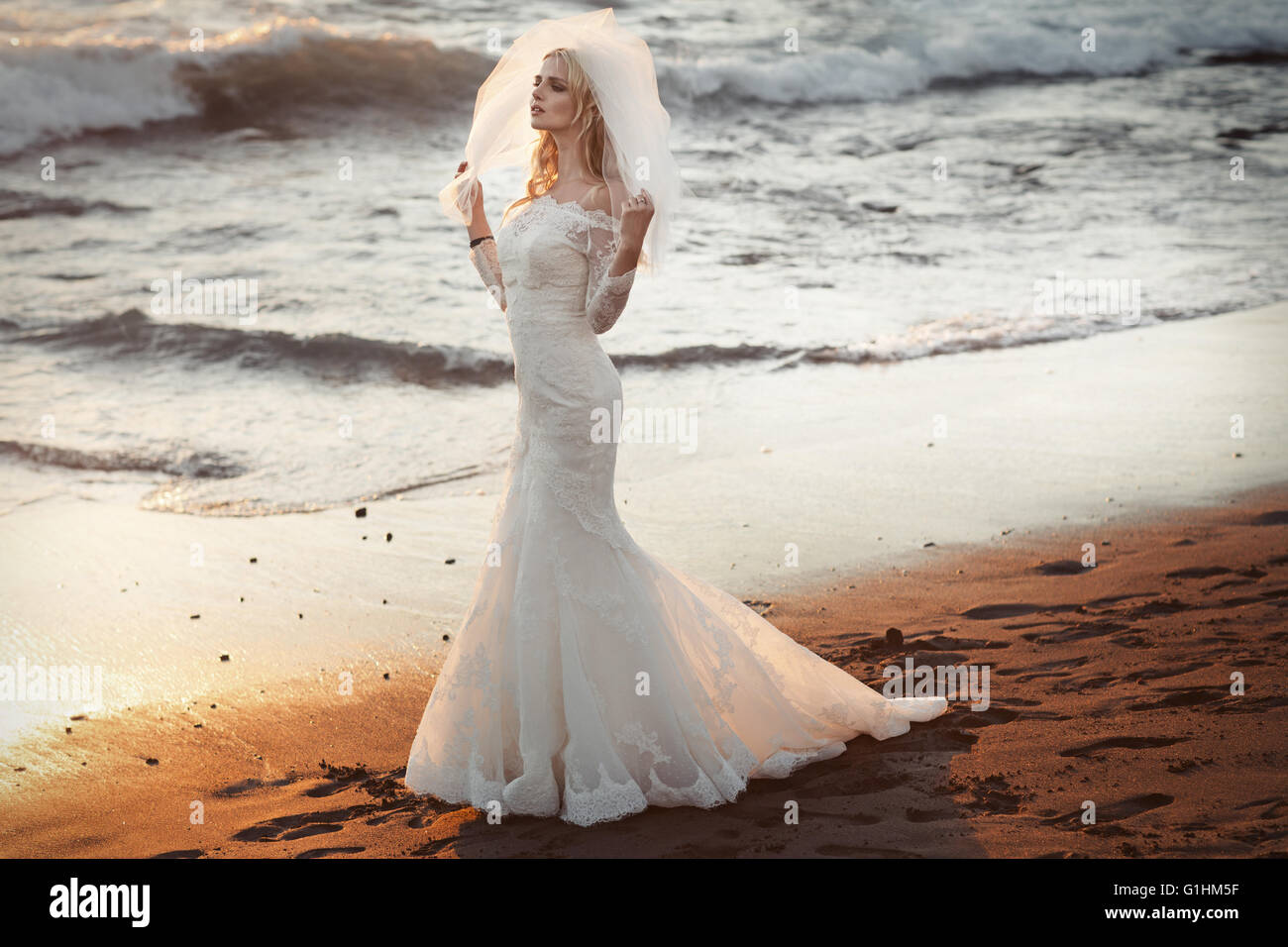 Lonely young bride looking for her husband Stock Photo - Alamy