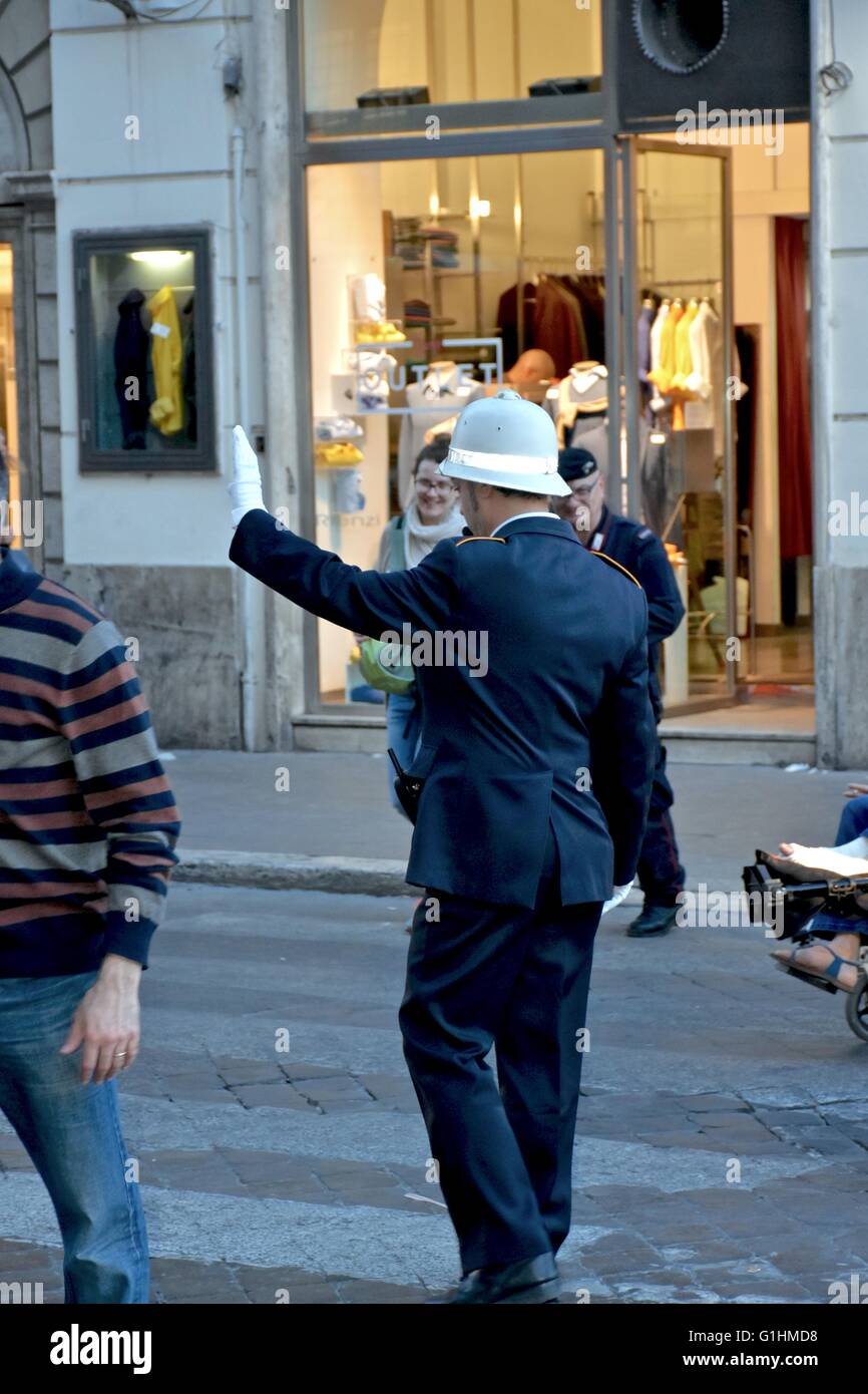 An Italian police officer doing traffic duty on the streets of Rome ...