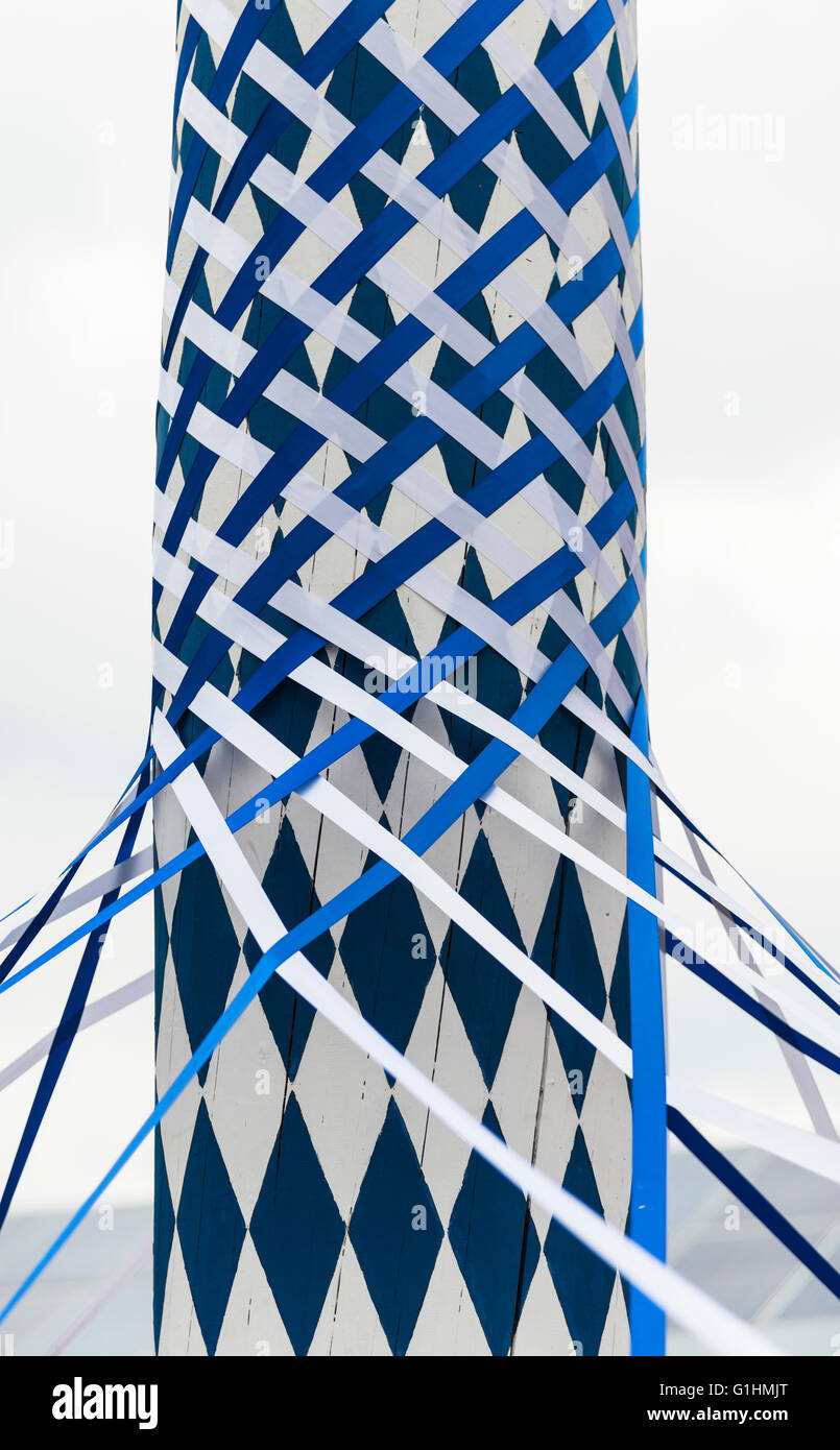 Pattern of blue and white ribbons on a wooden maypole formed during a ...