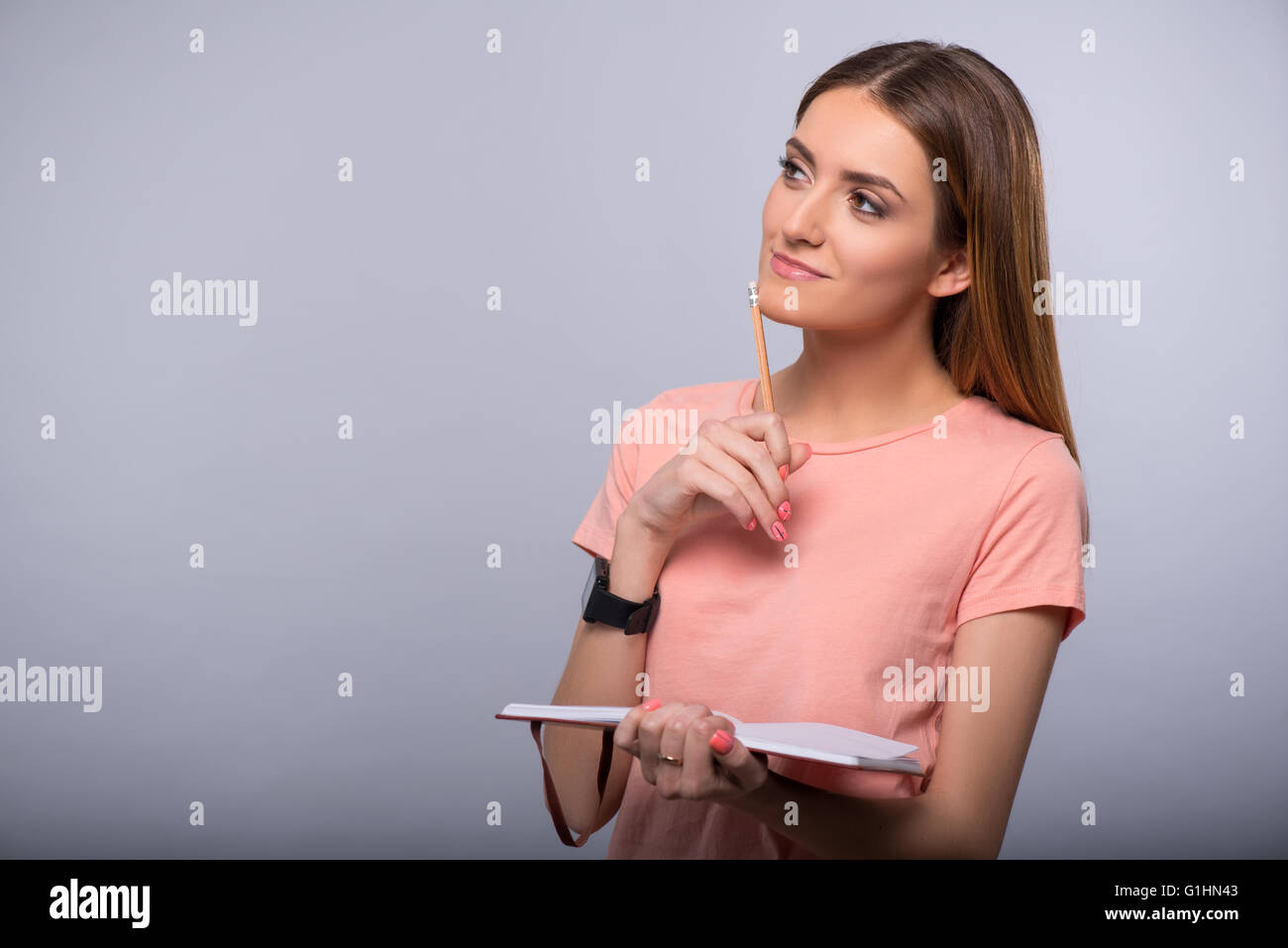 Positive woman thinking Stock Photo - Alamy