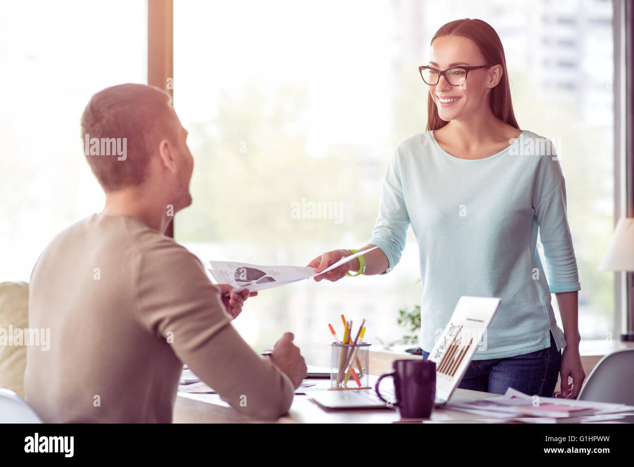 Positive colleagues working in the office Stock Photo - Alamy