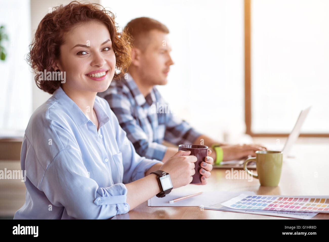 Positive colleagues working in the office Stock Photo - Alamy
