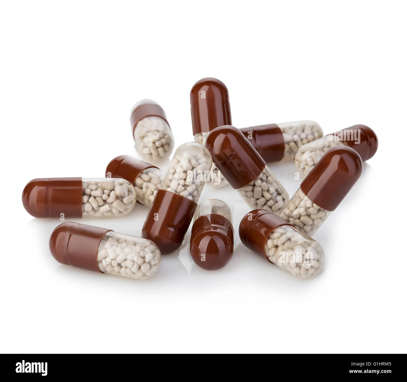 Brown capsules, pills close-up on a white background Stock Photo - Alamy