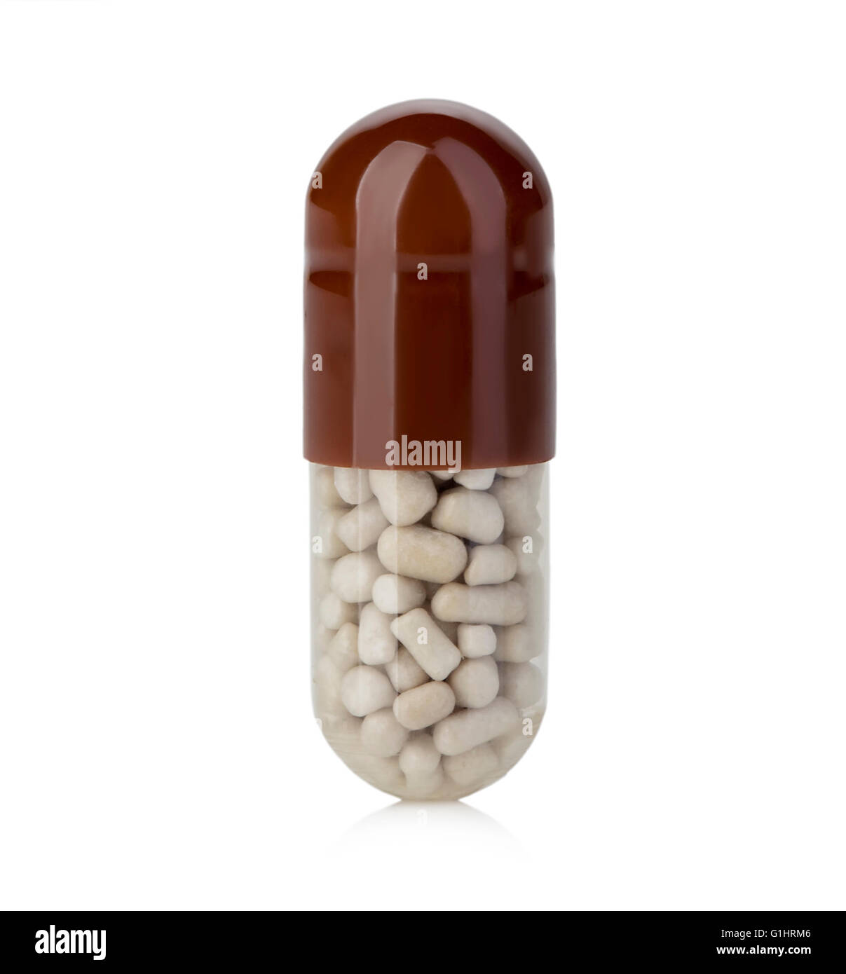 Brown capsule, pill close-up on a white background Stock Photo - Alamy