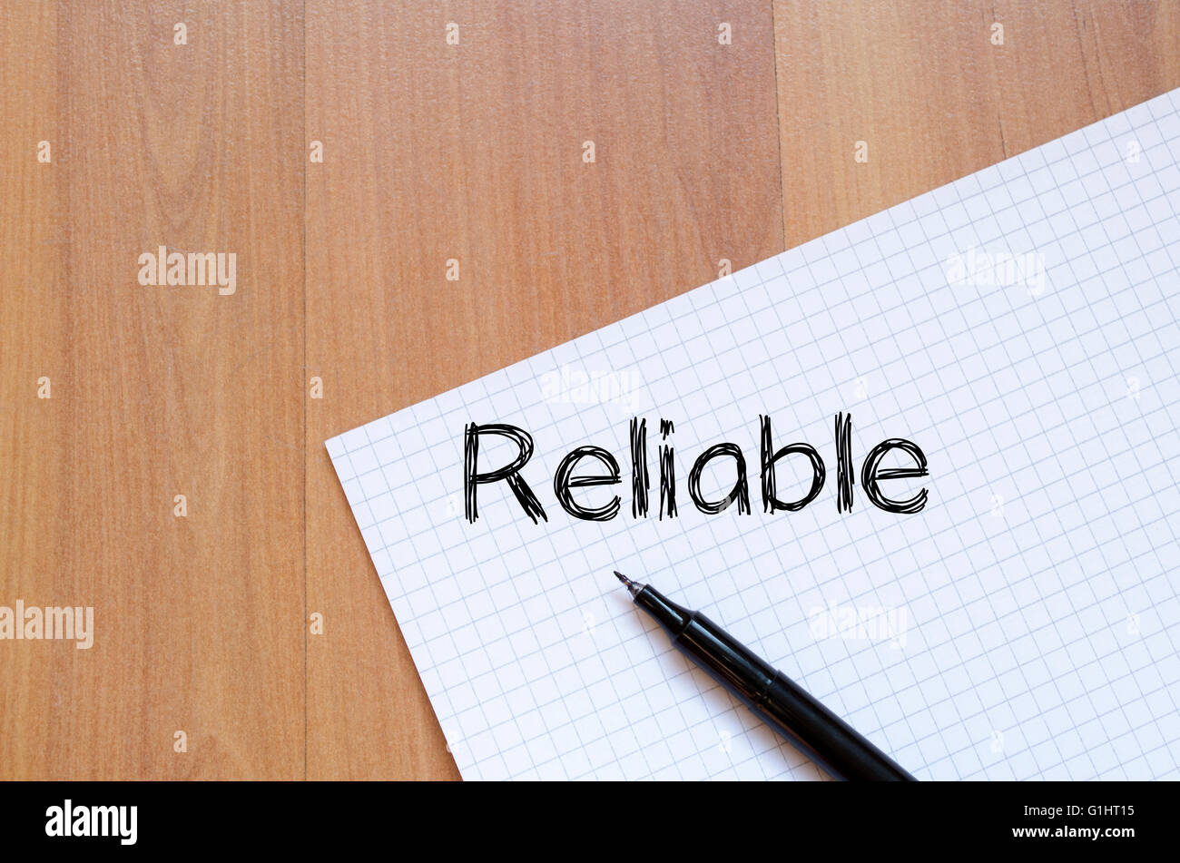 Reliable text concept write on notebook Stock Photo - Alamy
