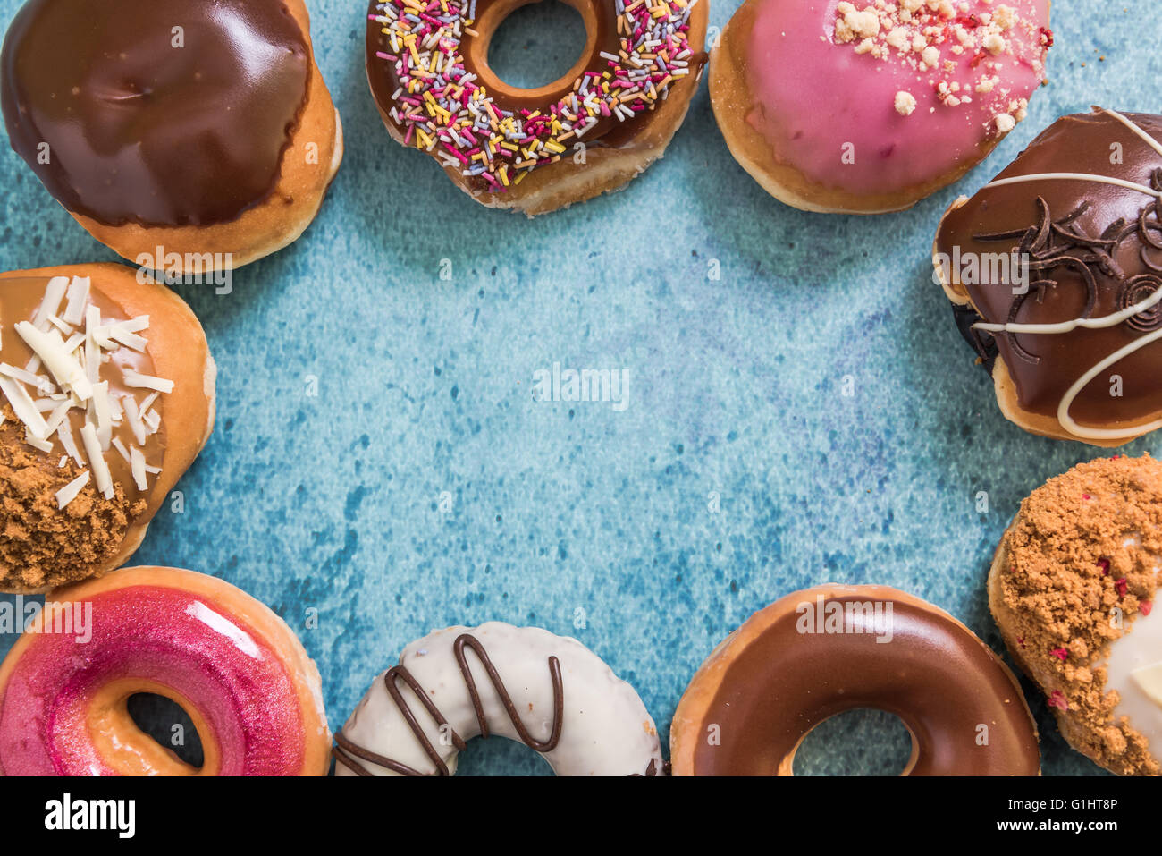 Donuts border background with copy space for recipe, vibrant colors ...