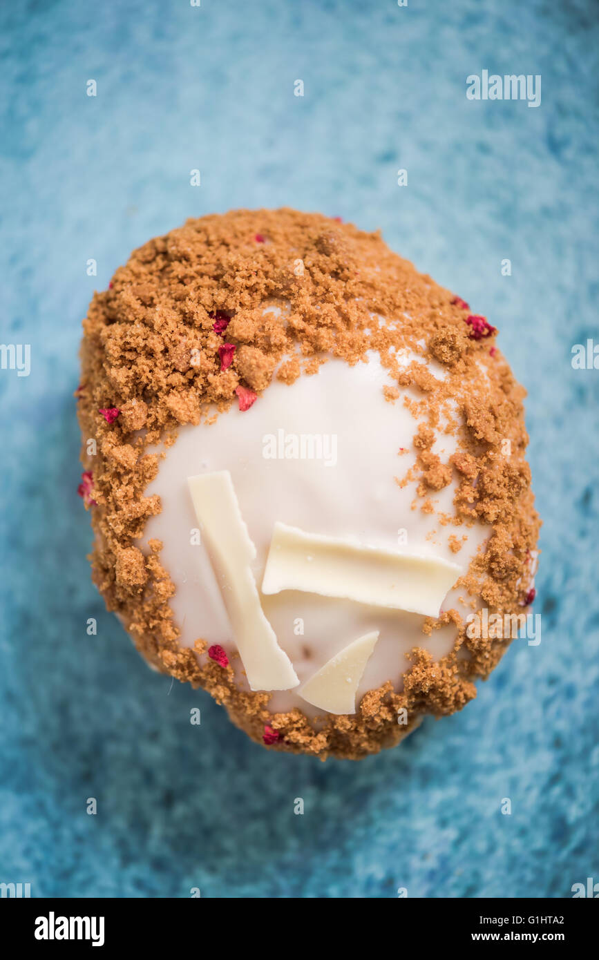 white chocolate glazed artisan donut, overhead view Stock Photo - Alamy