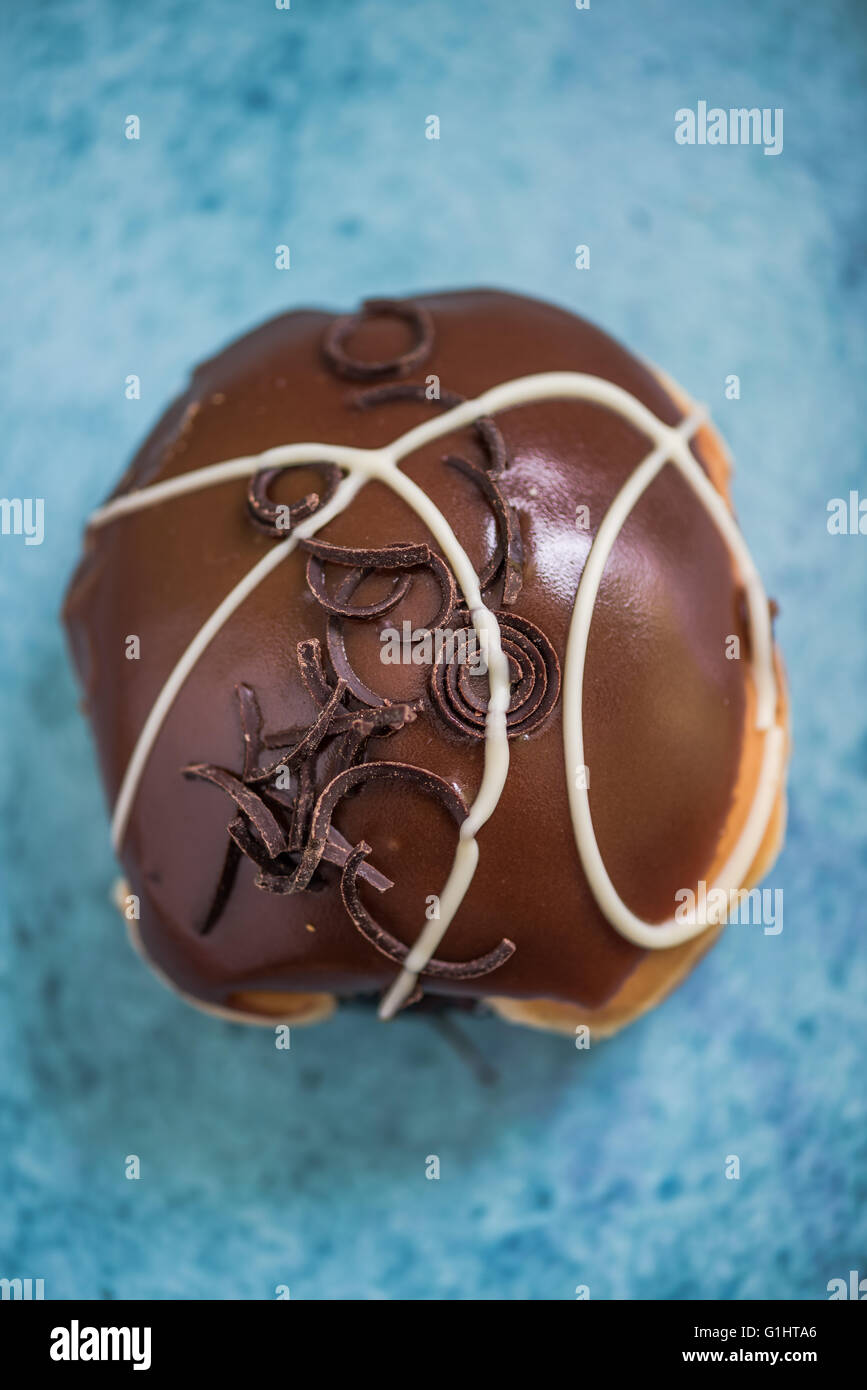 chocolate glazed artisan donut, overhead view Stock Photo - Alamy