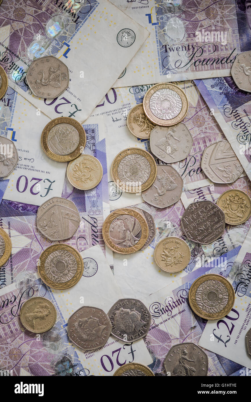 pound sterling coins and notes on table Stock Photo - Alamy