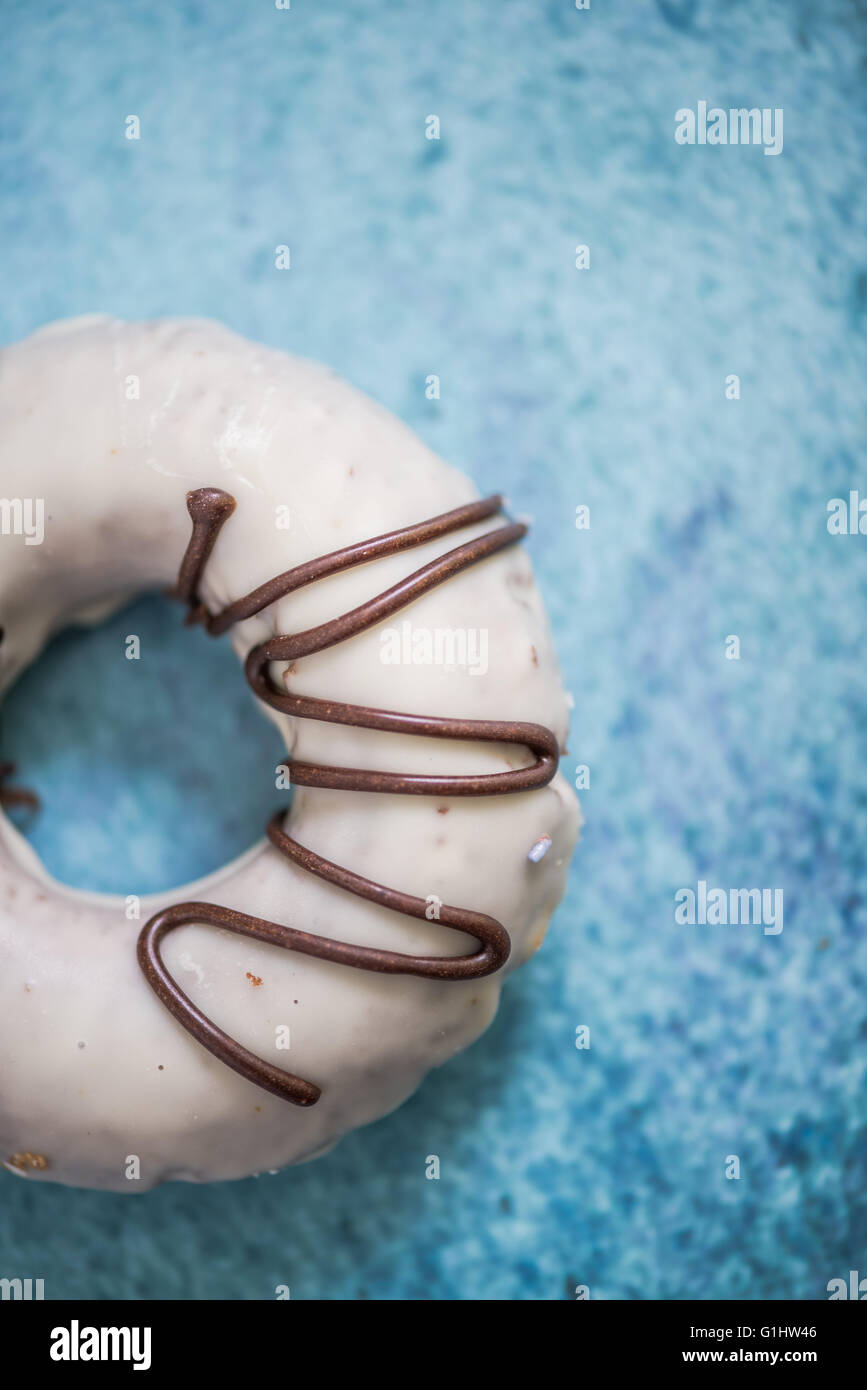 white chocolate glazed artisan donut, overhead view Stock Photo - Alamy