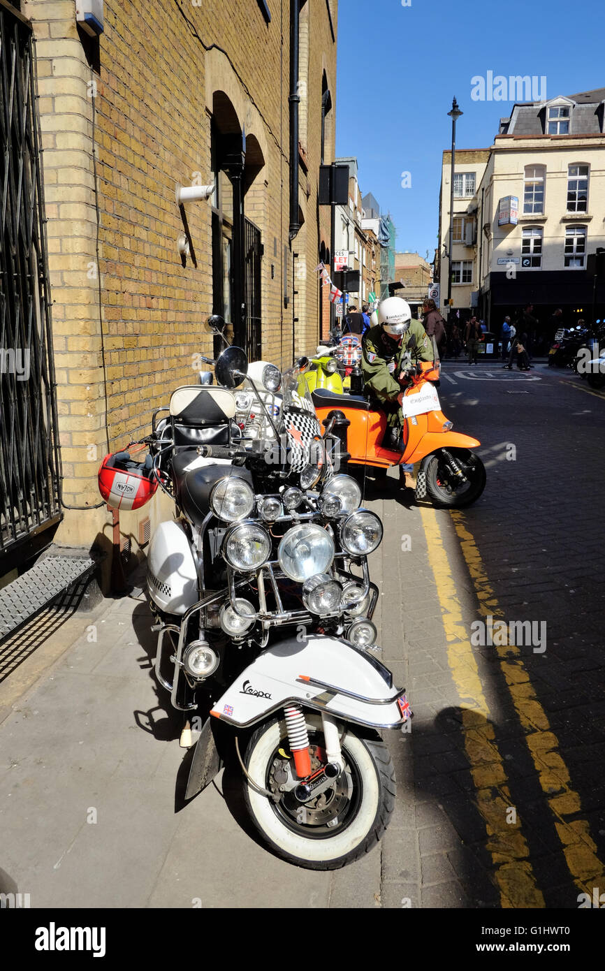 classic mopeds parked on a narrow pavement in the east end of London ...