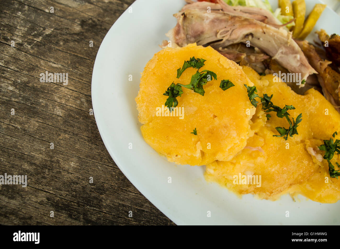 Traditional ecuadorian pork fritada typical serving, meat, potato ...