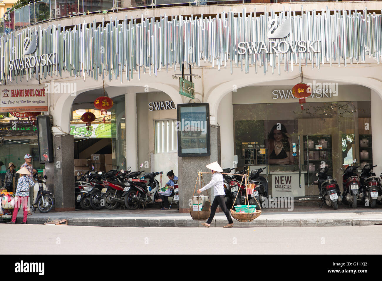 New shops in Old Hanoi and old forms of transport Stock Photo - Alamy